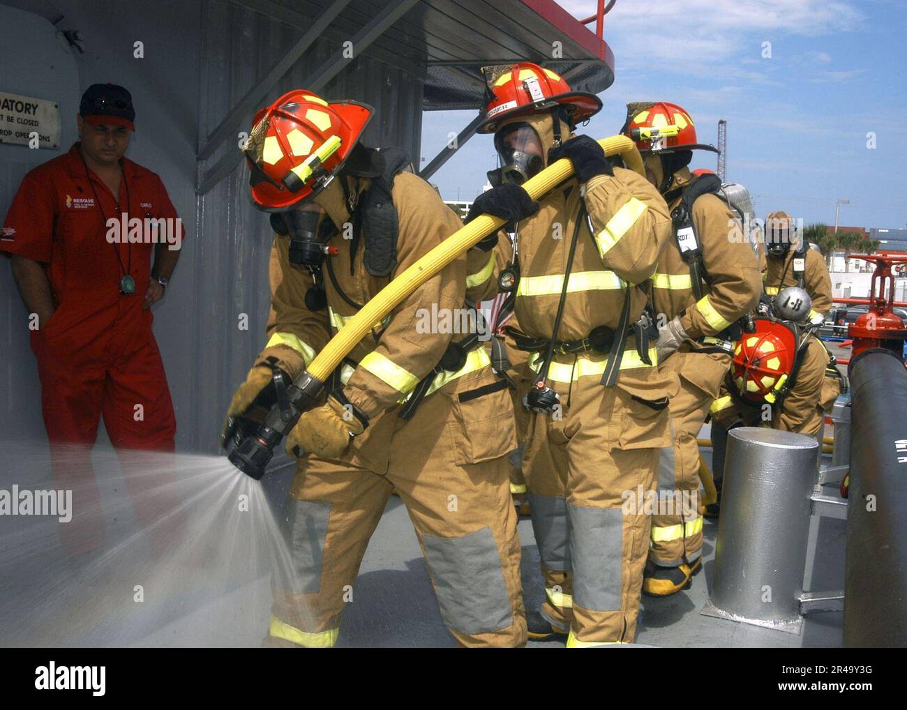 US Navy Members assigned to USS Enterprise (CVN 65) Damage Control Team ...