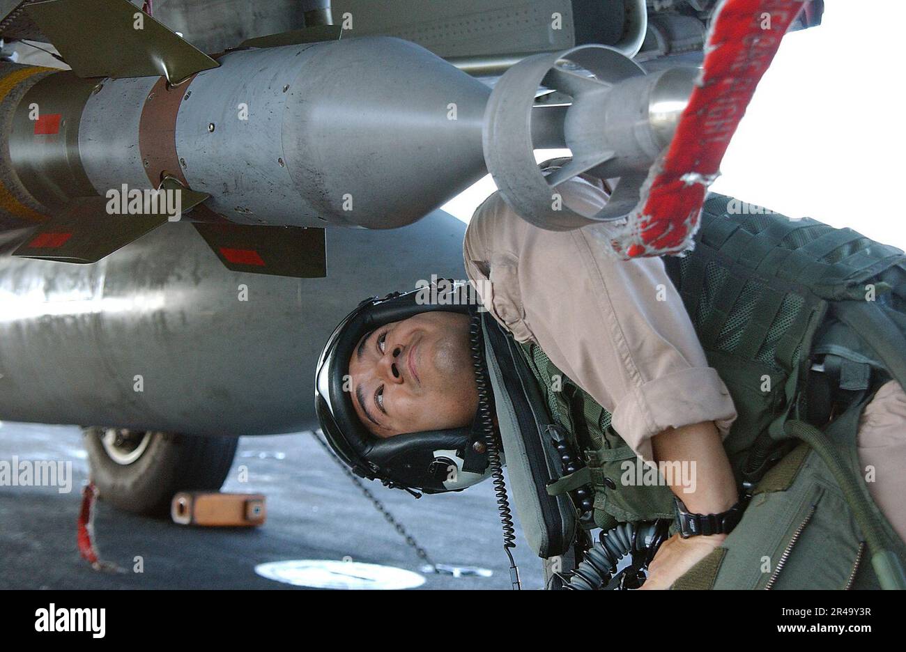 US Navy Lt. checks a Laser-Guided Bomb on an F-14B Tomcat Stock Photo ...