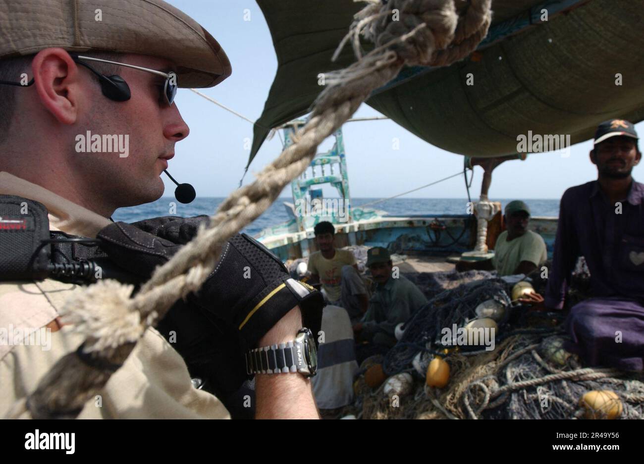 US Navy Lt. j.g. leads a Vessel Board Search and Seizure team from USS ...