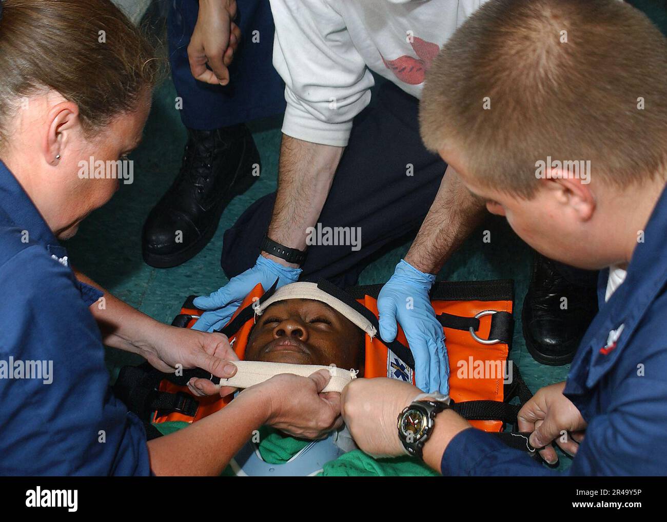 US Navy Medical response team members use their skills as a teaching ...