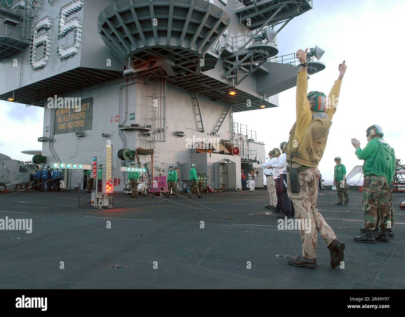 US Navy Lt. Cmdr. gives the signal to light up the Manually Operated ...