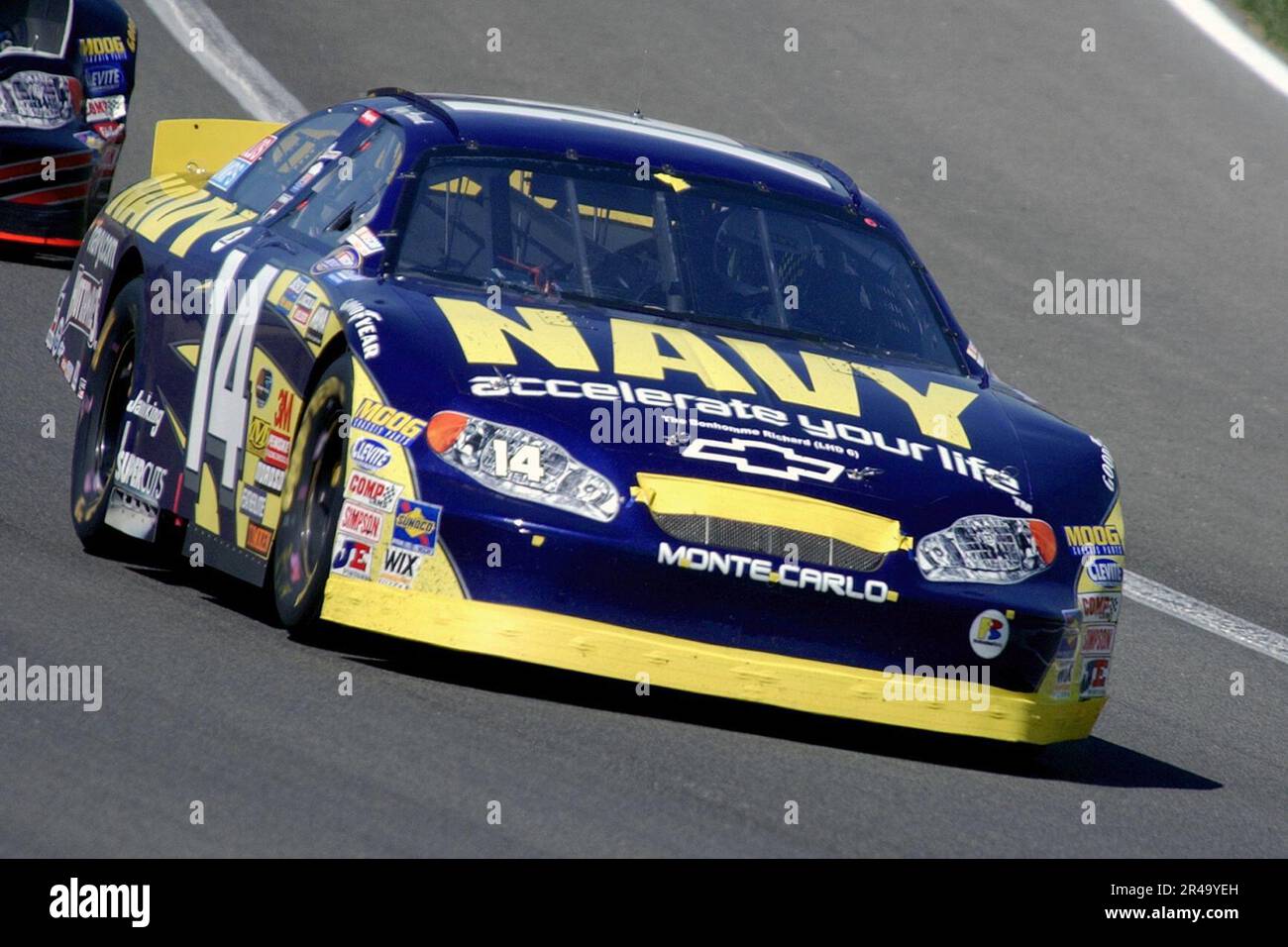 US Navy The Navy No. 14 Chevy Monte Carlo NASCAR races around turn four ...