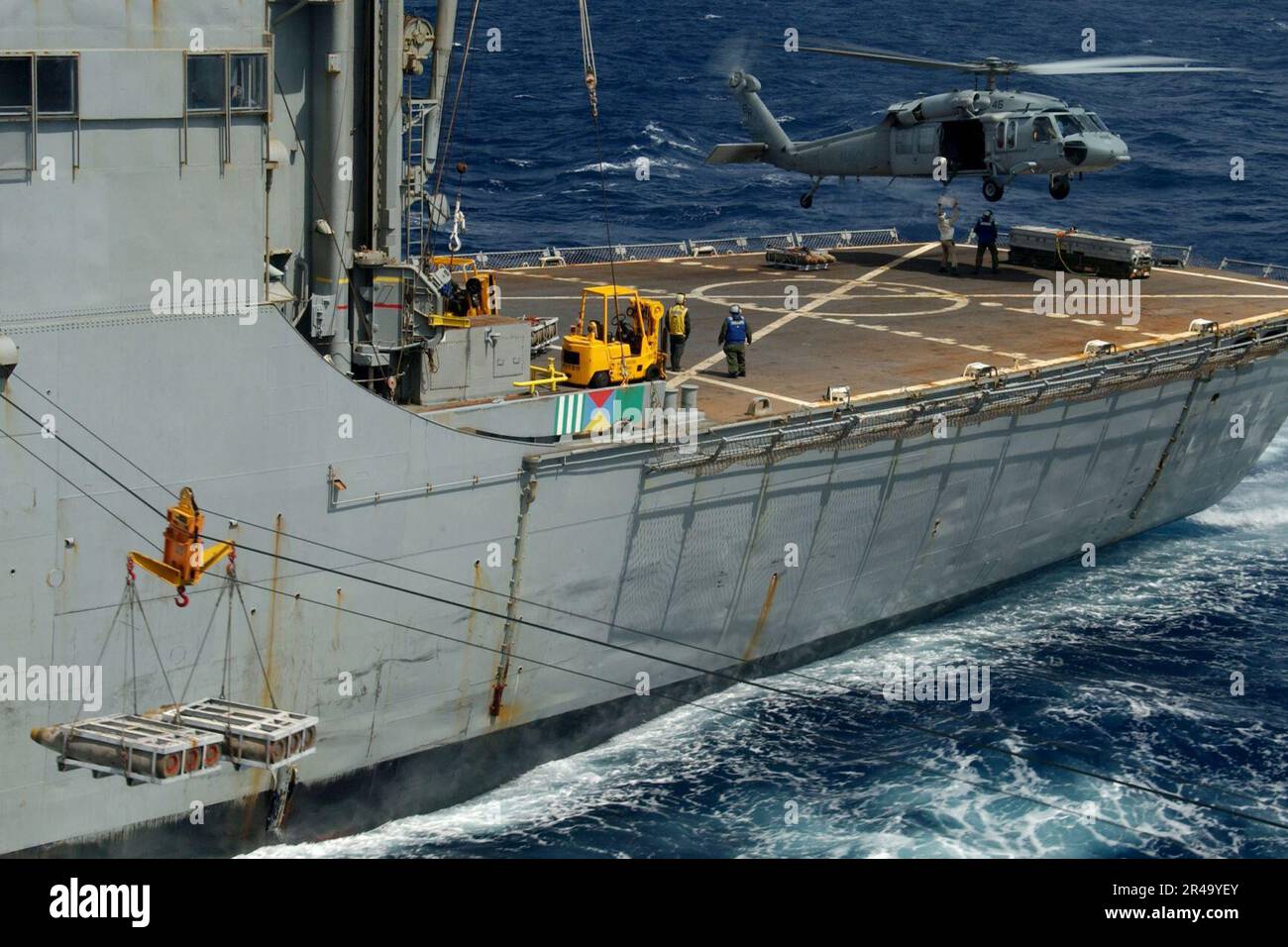 US Navy Ordnance is sent across a cable from the Military Sealift ...