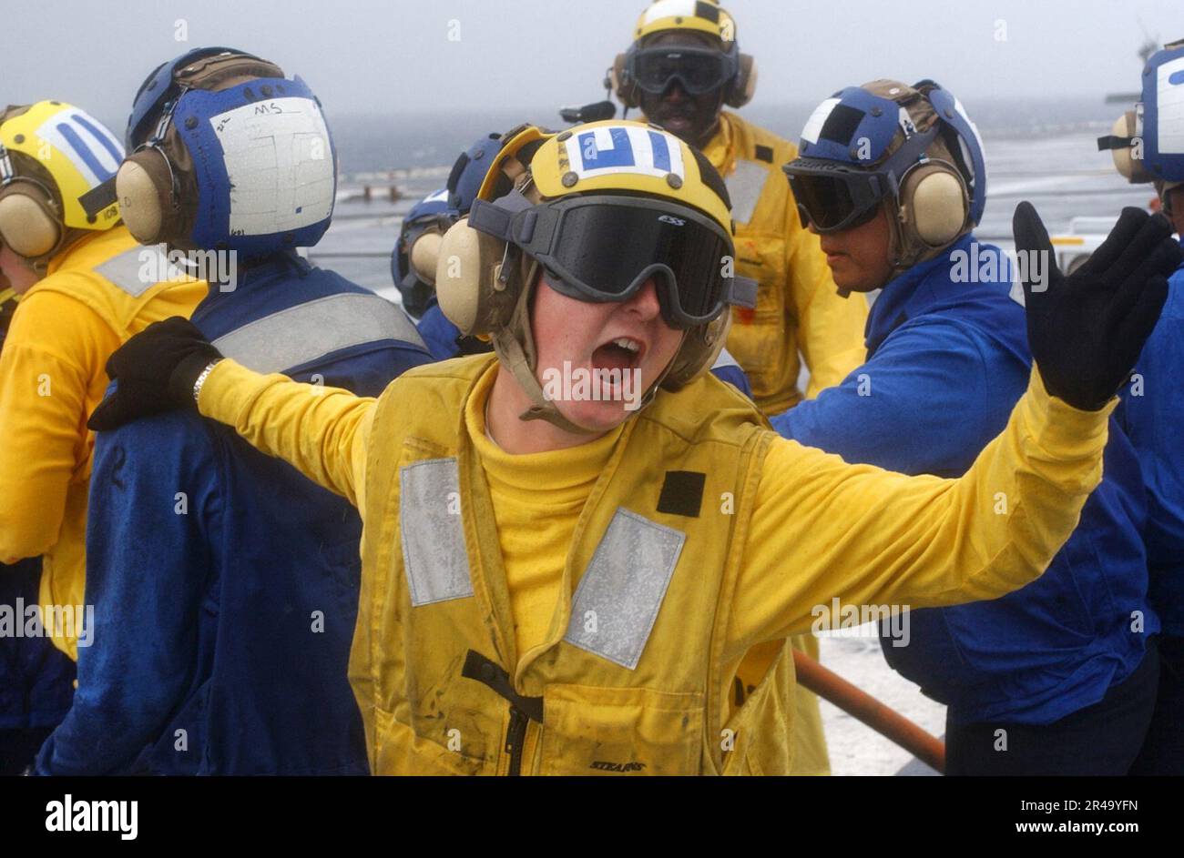 US Navy rge of her fire team during a flight deck fire drill aboard USS ...