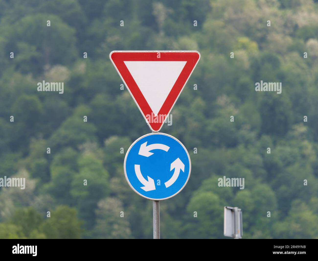 The roundabout road sign on the highway road Stock Photo - Alamy
