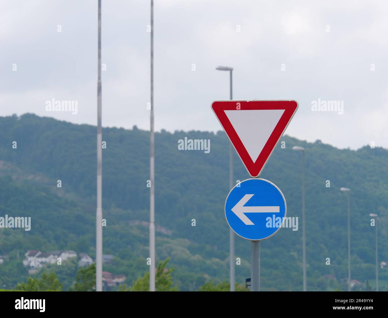 The roundabout road sign on the highway road Stock Photo - Alamy