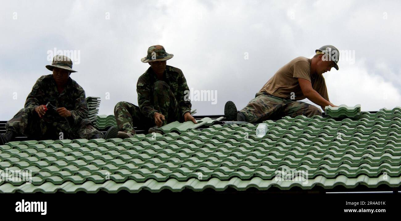 US Navy Builder Constructionman assigned to Naval Mobile Construction ...