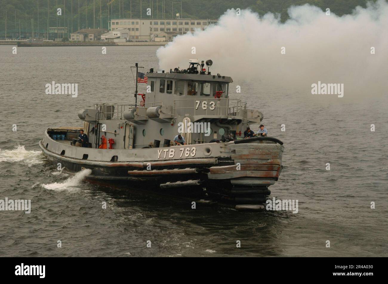 US Navy Harbor Tug USS Muskegon (YTB 763) repositions while working ...