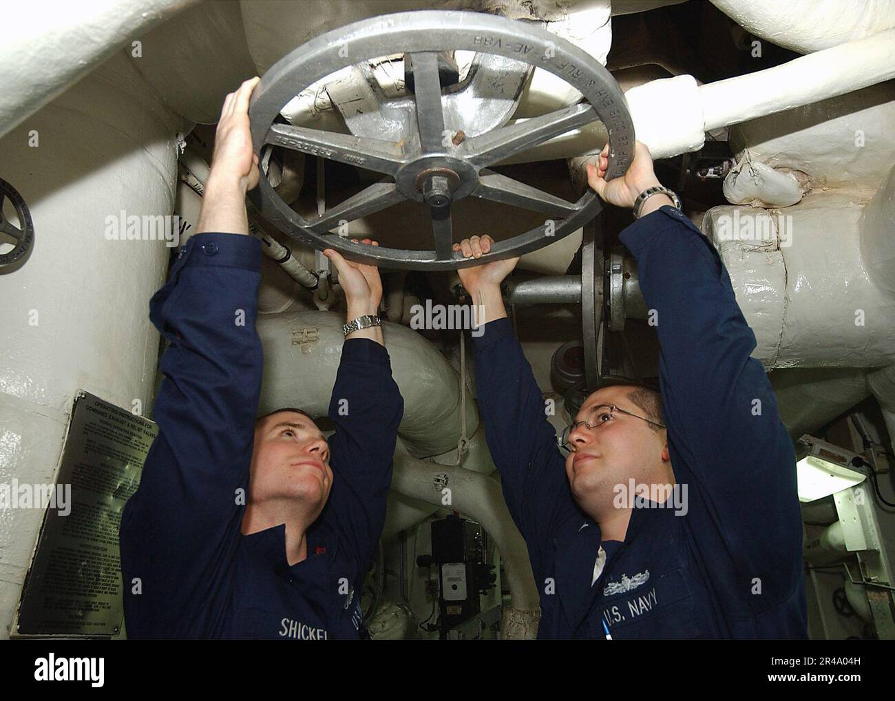 US Navy Machinist Mate 2nd left, and Machinist Mate 1st Class position ...