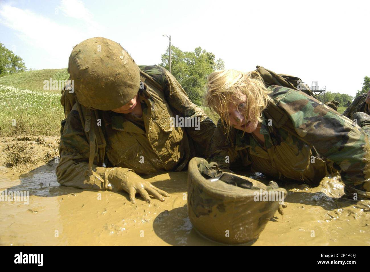 US Navy Midshipmen offer each other encouragement as they maneuver ...