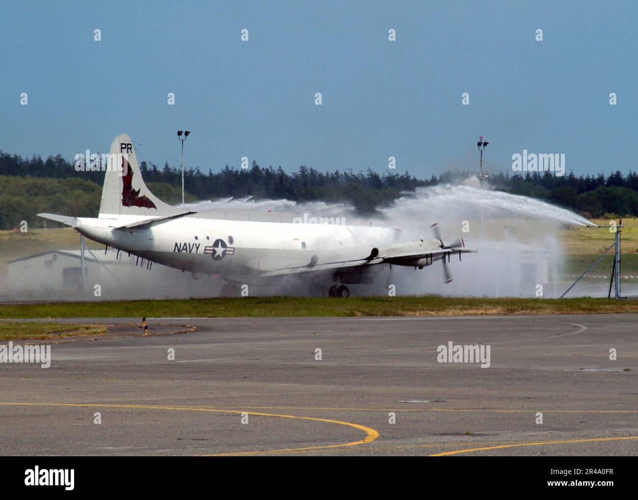 US Navy A EP-3E Orion is slowly driven into a freshwater wash station ...