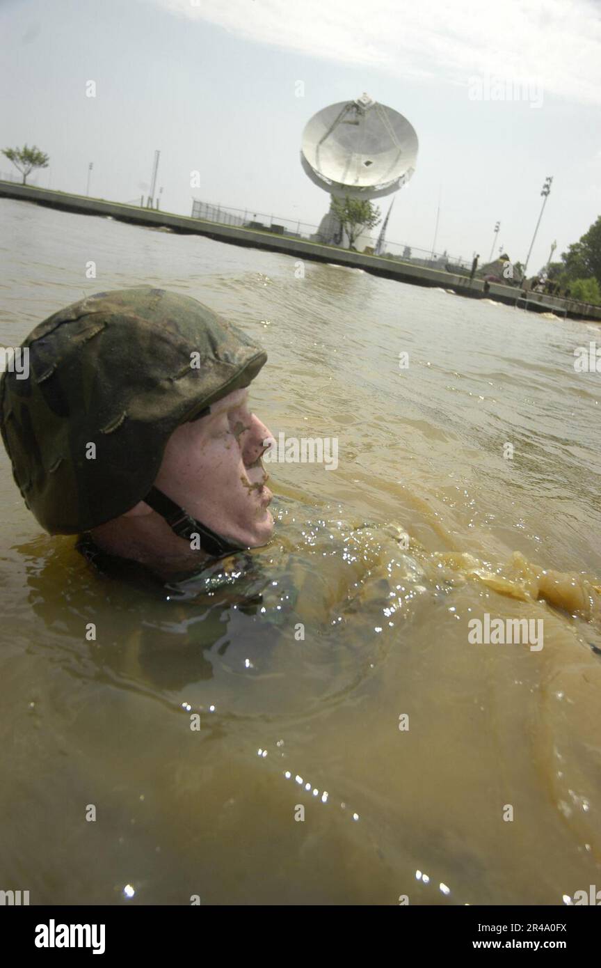 US Navy A Midshipman washes sand and mud off in the Chesapeake during ...