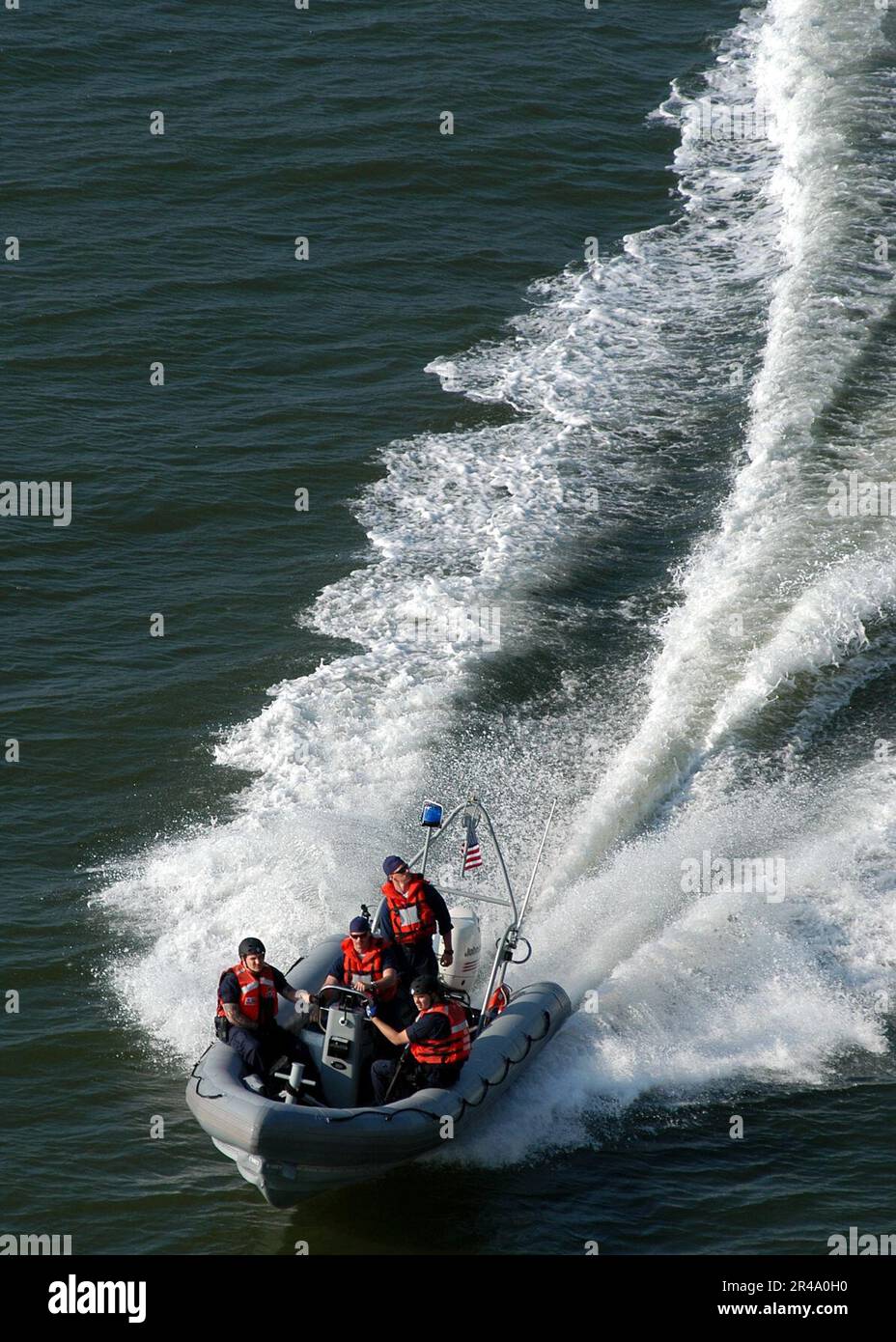 US Navy United States Coast Guardsmen in a Rigid Hull Inflatable Boat ...