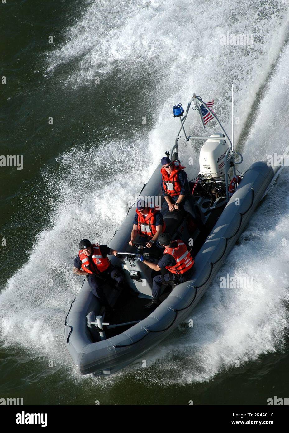 US Navy United States Coast Guardsmen in a Rigid Hull Inflatable Boat ...