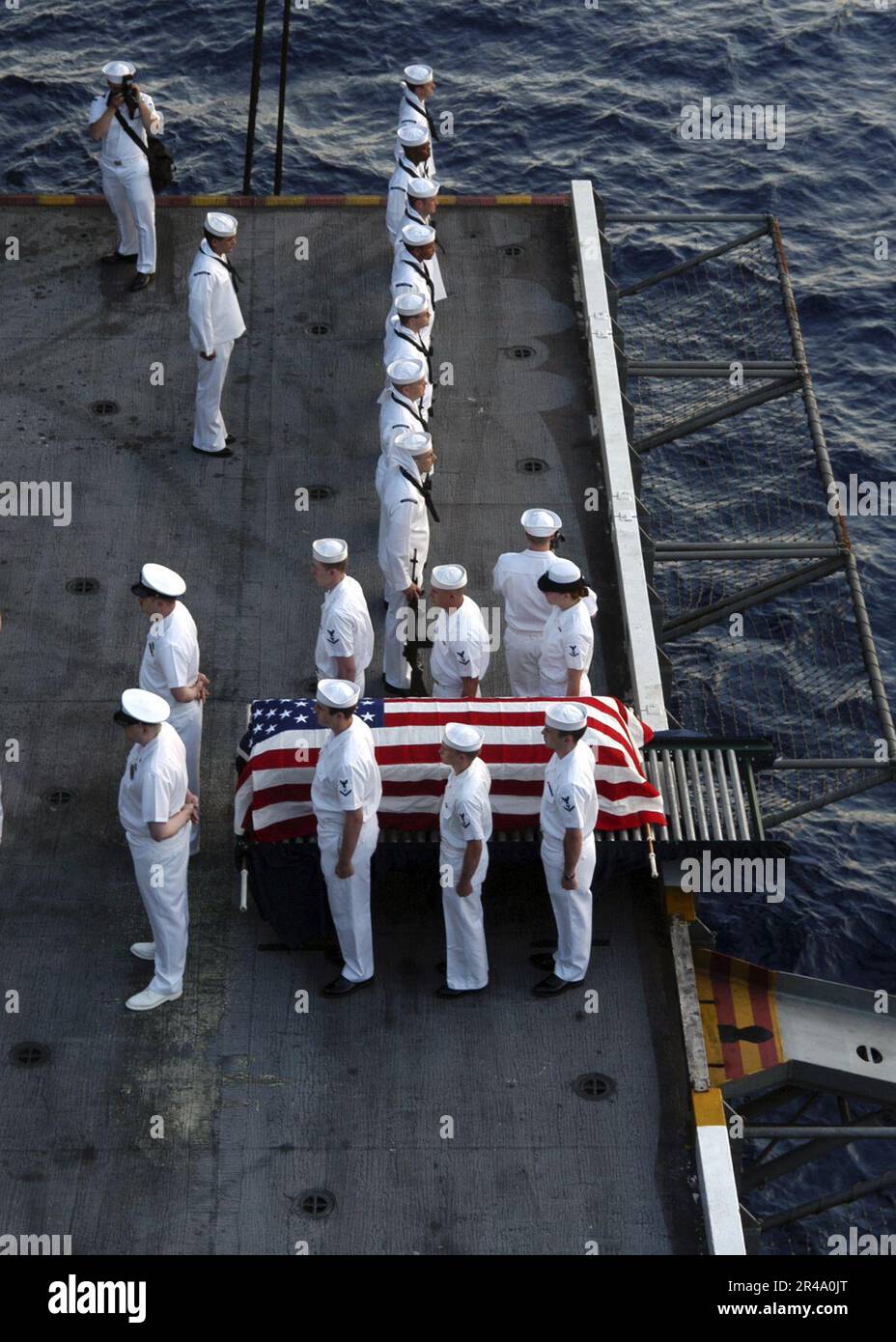 US Navy Crew members aboard USS Enterprise (CVN 65) conduct a Burial at ...
