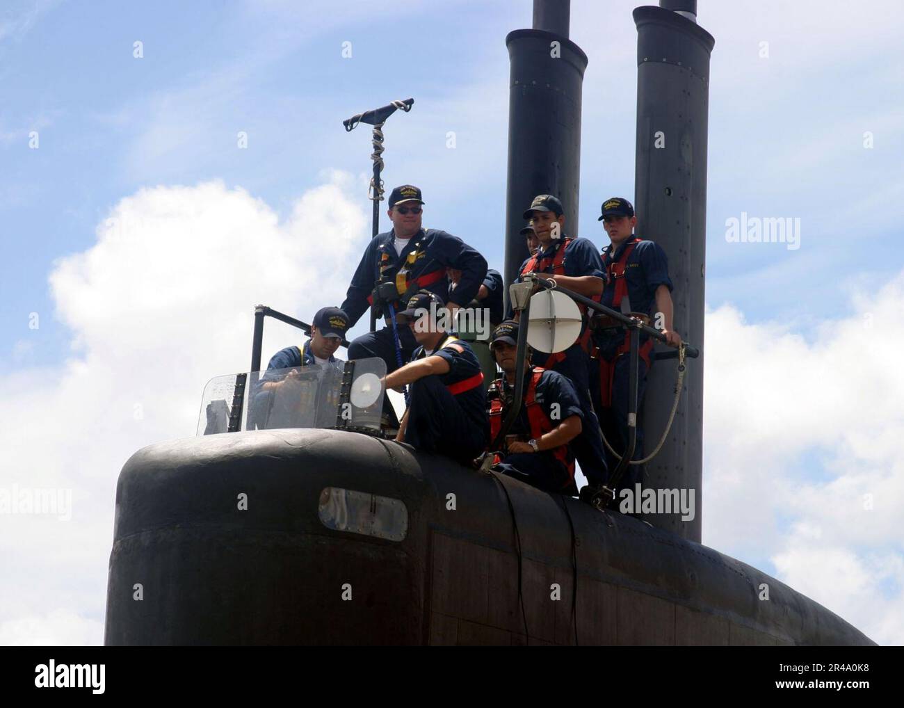 US Navy Commanding Officer Cmdr. center, USS Tucson (SSN 770), and ...