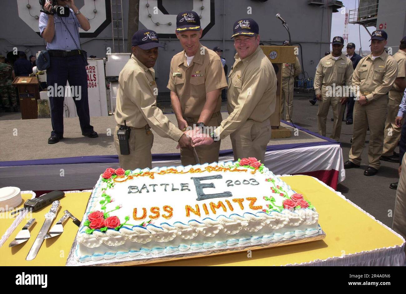 US Navy Command Master Chief left, Commanding Officer middle, and ...
