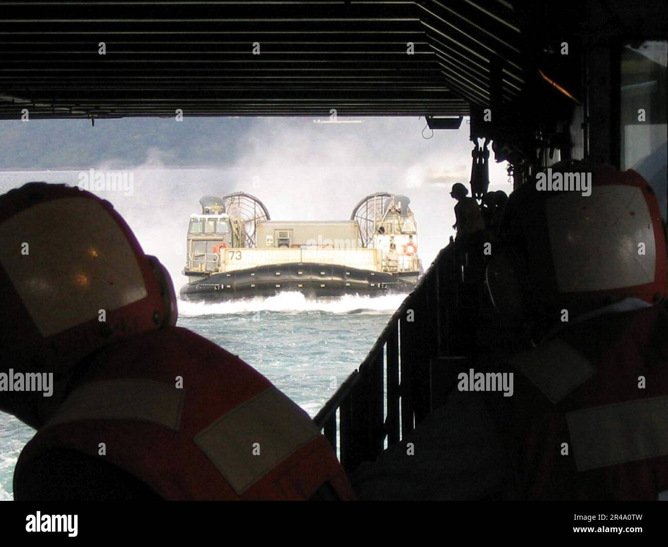 US Navy Sailors aboard the amphibious dock landing ship USS Fort ...