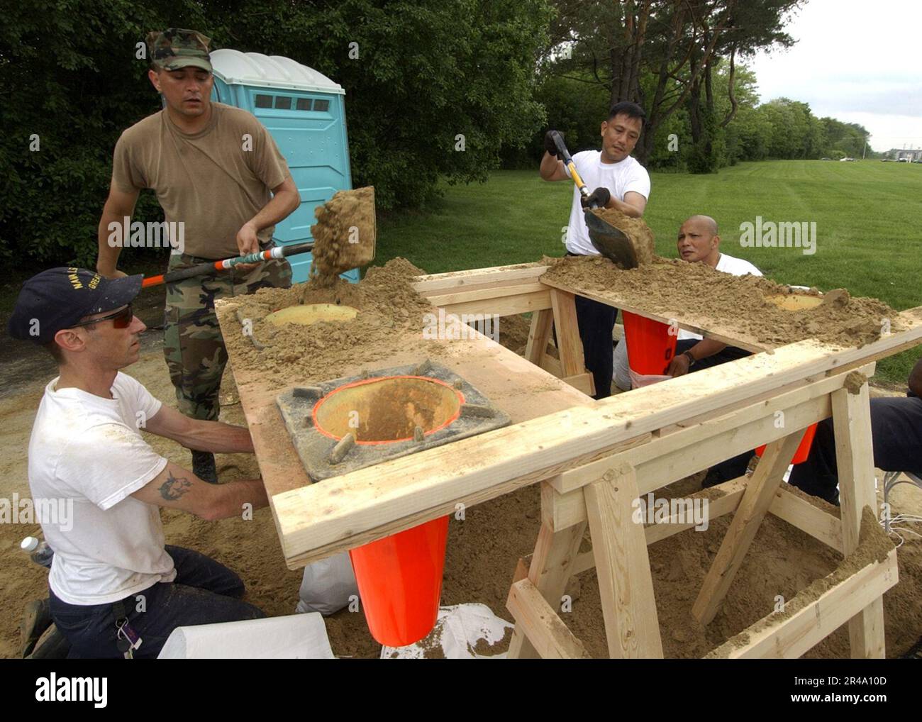 US Navy Builder 1st Class assigned to Construction Battalion Unit 401 ...