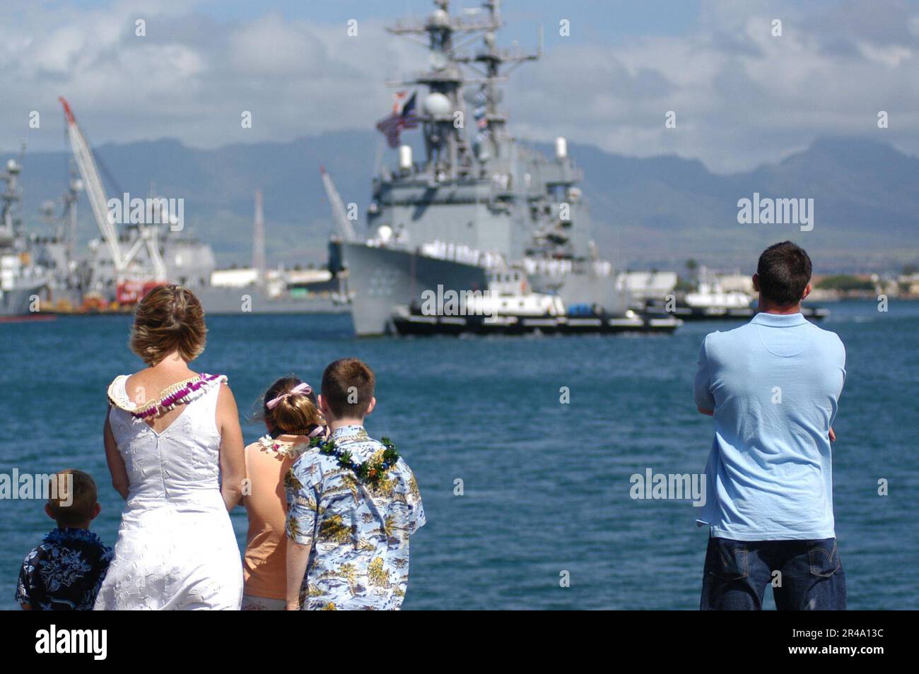 US Navy Family and friends watch as the Spruance Class destroyer USS ...