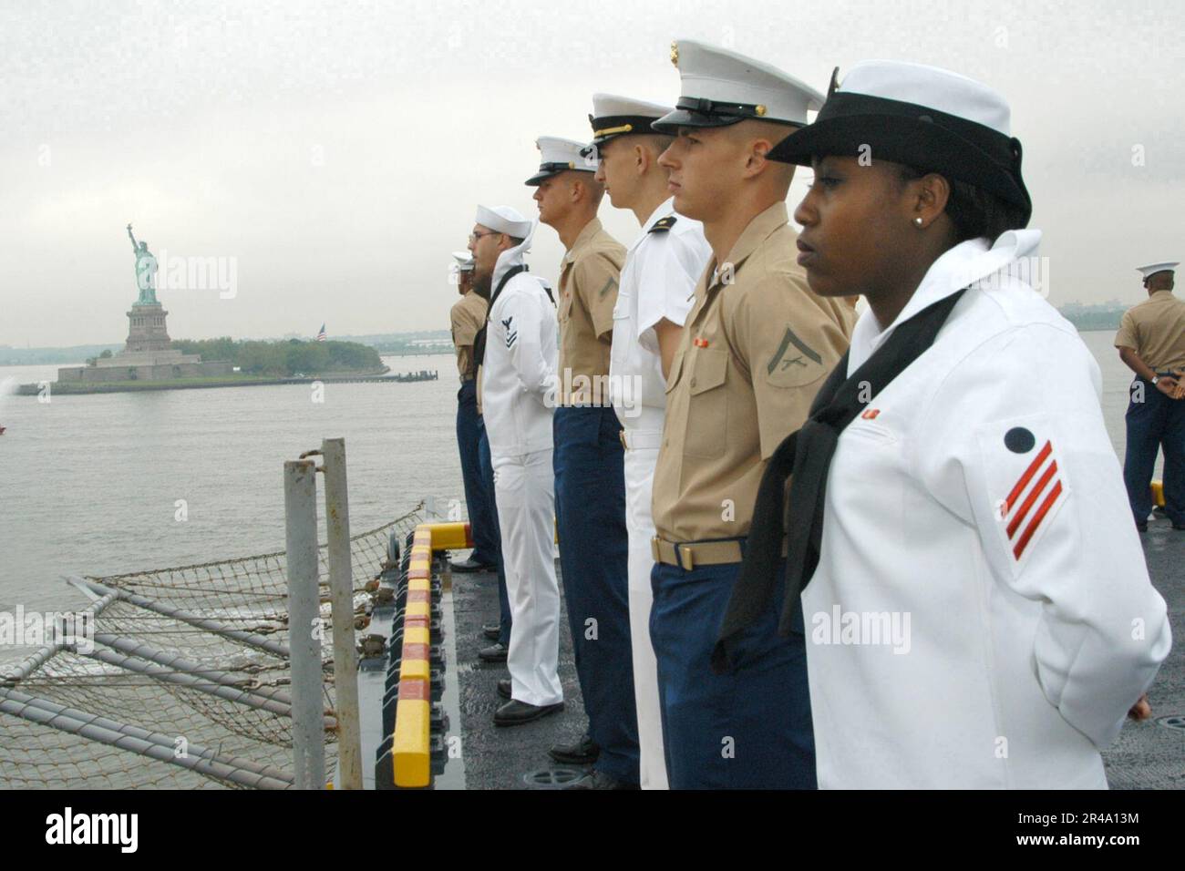 Us Navy Sailors And Marines Man The Rails Aboard The Amphibious Assault Ship Uss Iwo Jima Lhd 7