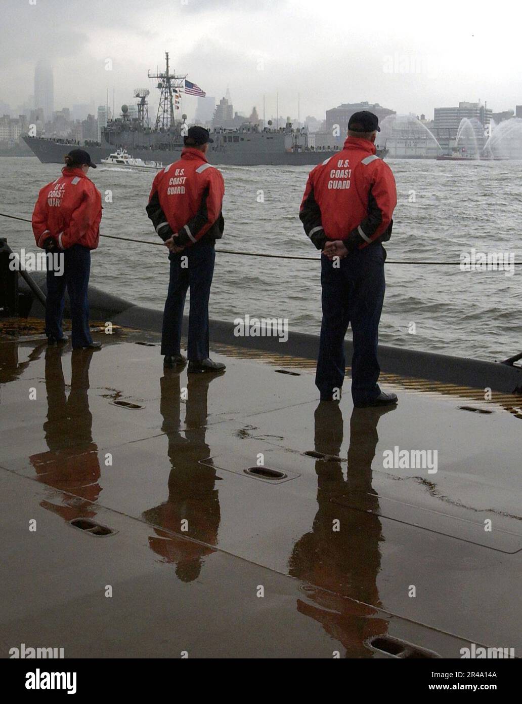 US Navy Crew members assigned to the Keeper-class coastal bouy tender ...