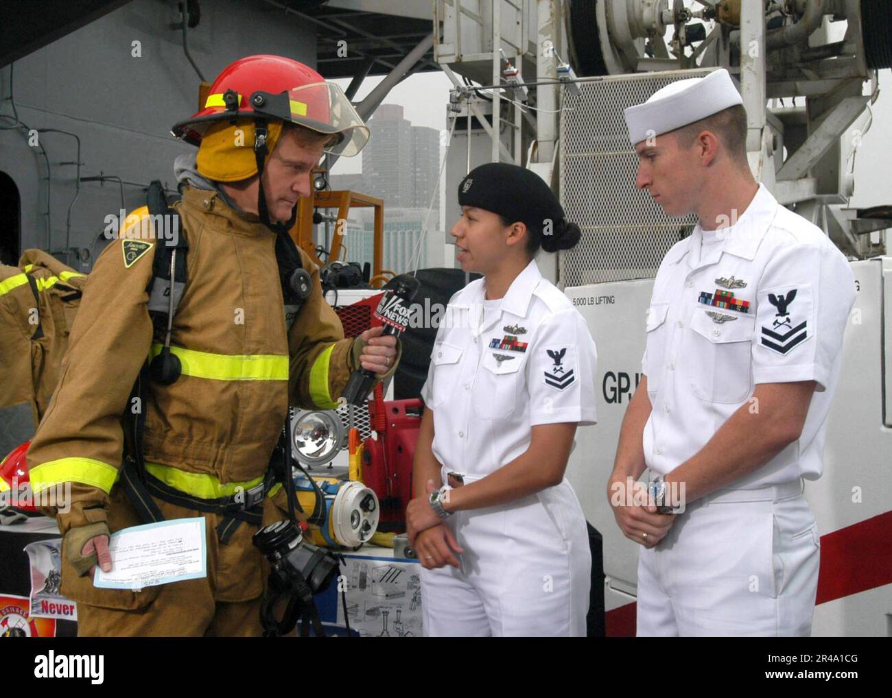US Navy Steve Doocy of Fox News, interviews Damage Controlman Stock ...