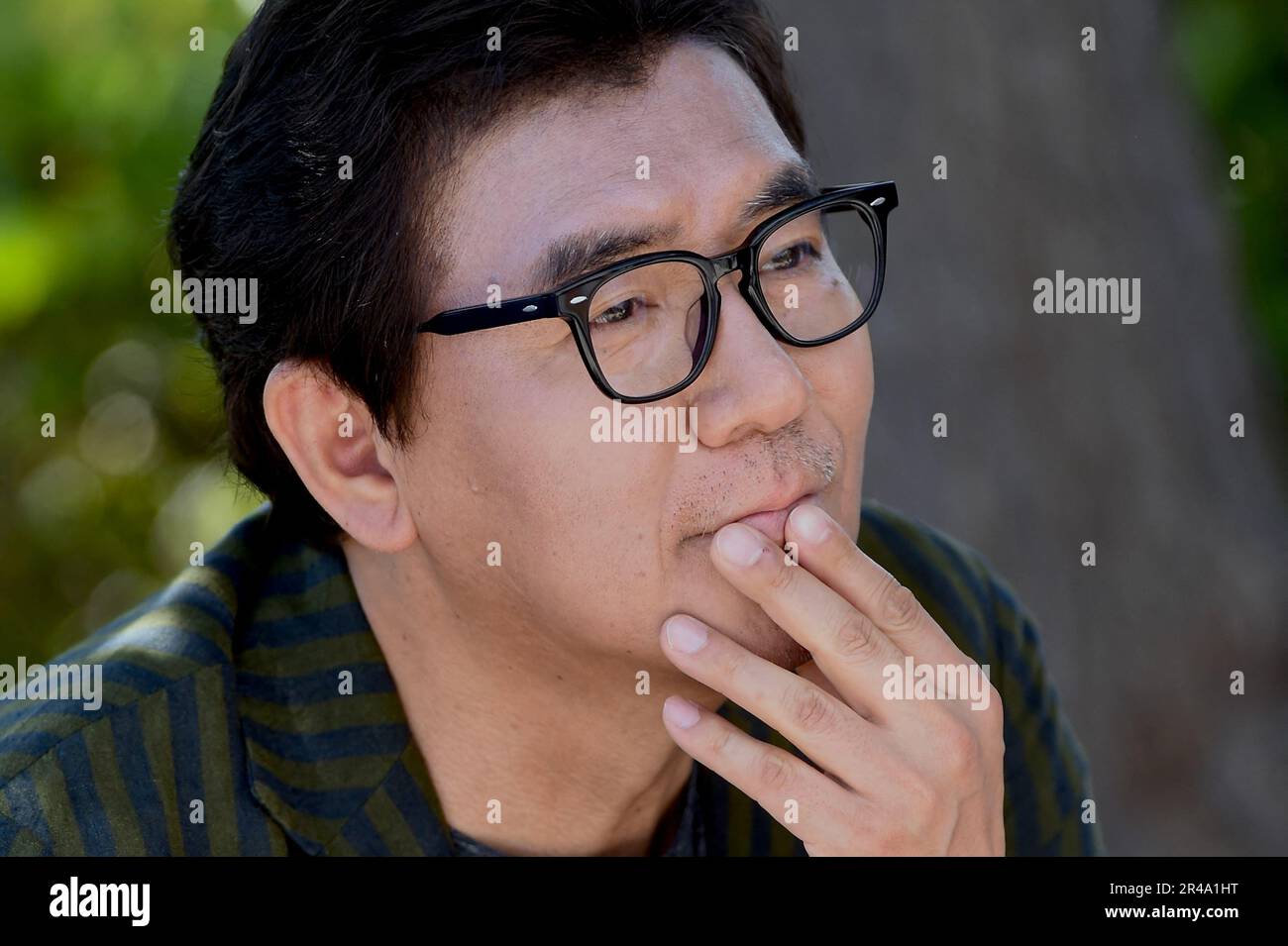 Cannes, France. 26th May, 2023. Kim Ji woon attends the Cobweb (Dans La Toile) photocall at the ...
