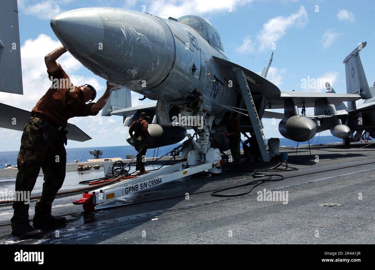 US Navy Airman and other members assigned to the Black Aces of Strike ...