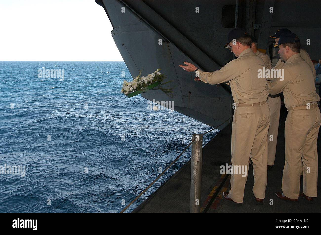 US Navy Navy officers pay their respects to fallen service members ...