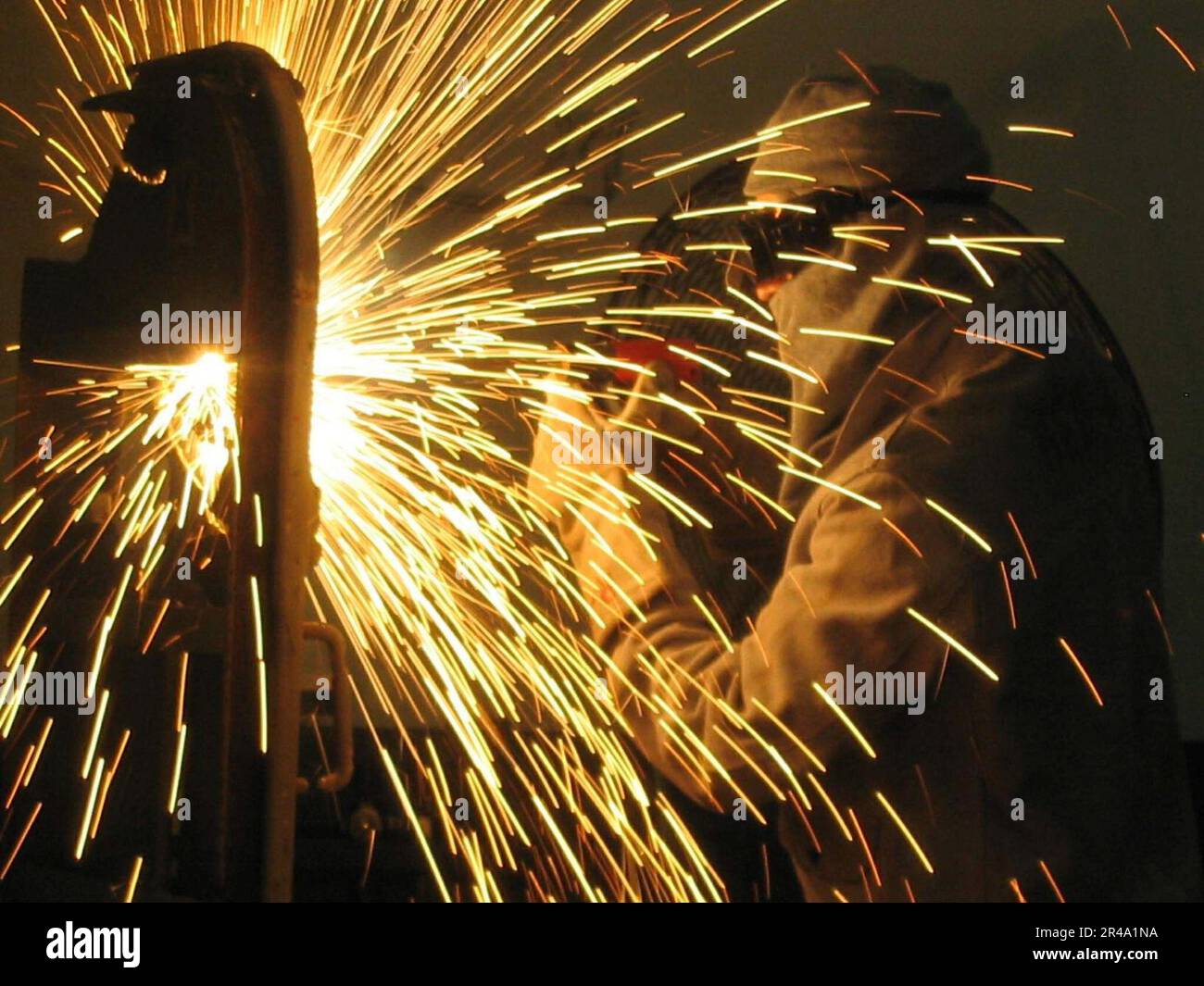US Navy Hull Maintenance Technician uses one of the various metal ...