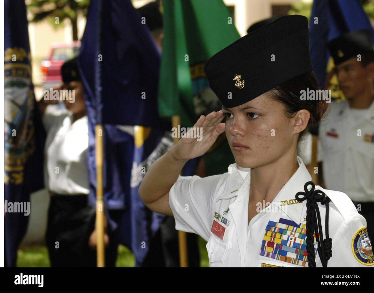 US Navy Battalion Commander Cadet Junior ROTC, salutes during the ...