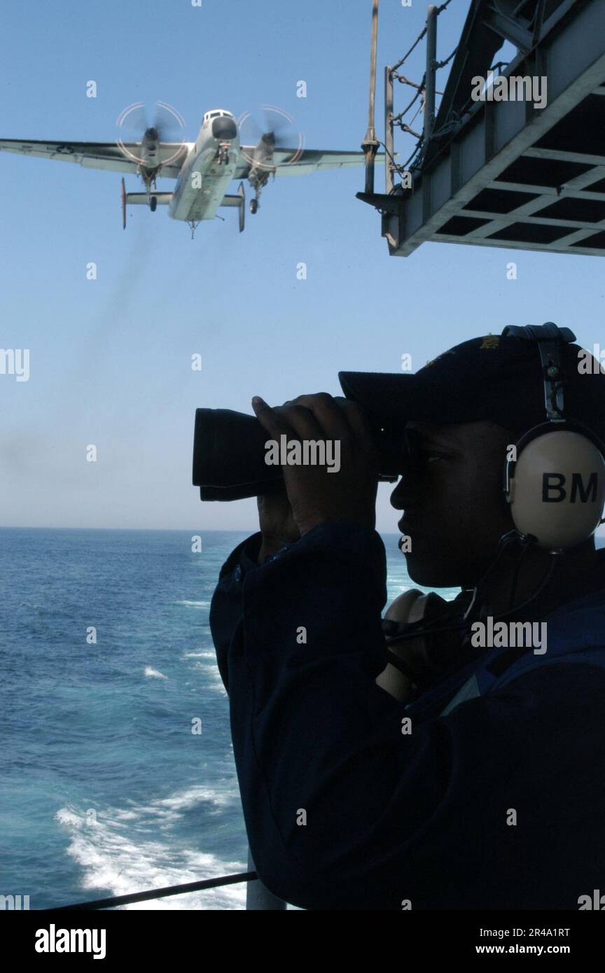 US Navy Seaman Apprentice stands watch on the fantail aboard the ...