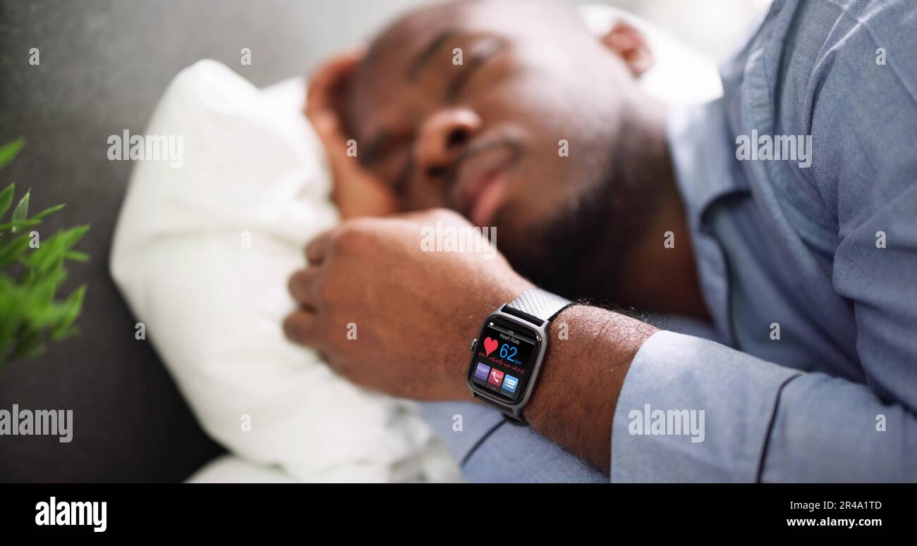 Man Sleeping With Smart Watch In His Hand Showing Heartbeat Rate Stock ...