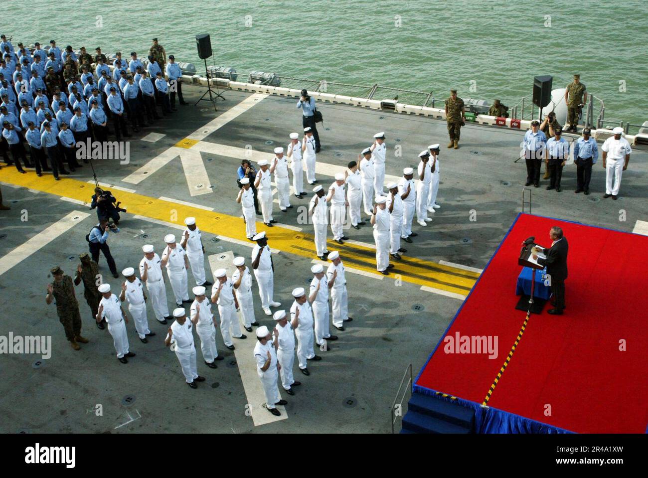 US Navy Secretary of Defense Donald Rumsfeld re-enlists 30 Sailors and ...