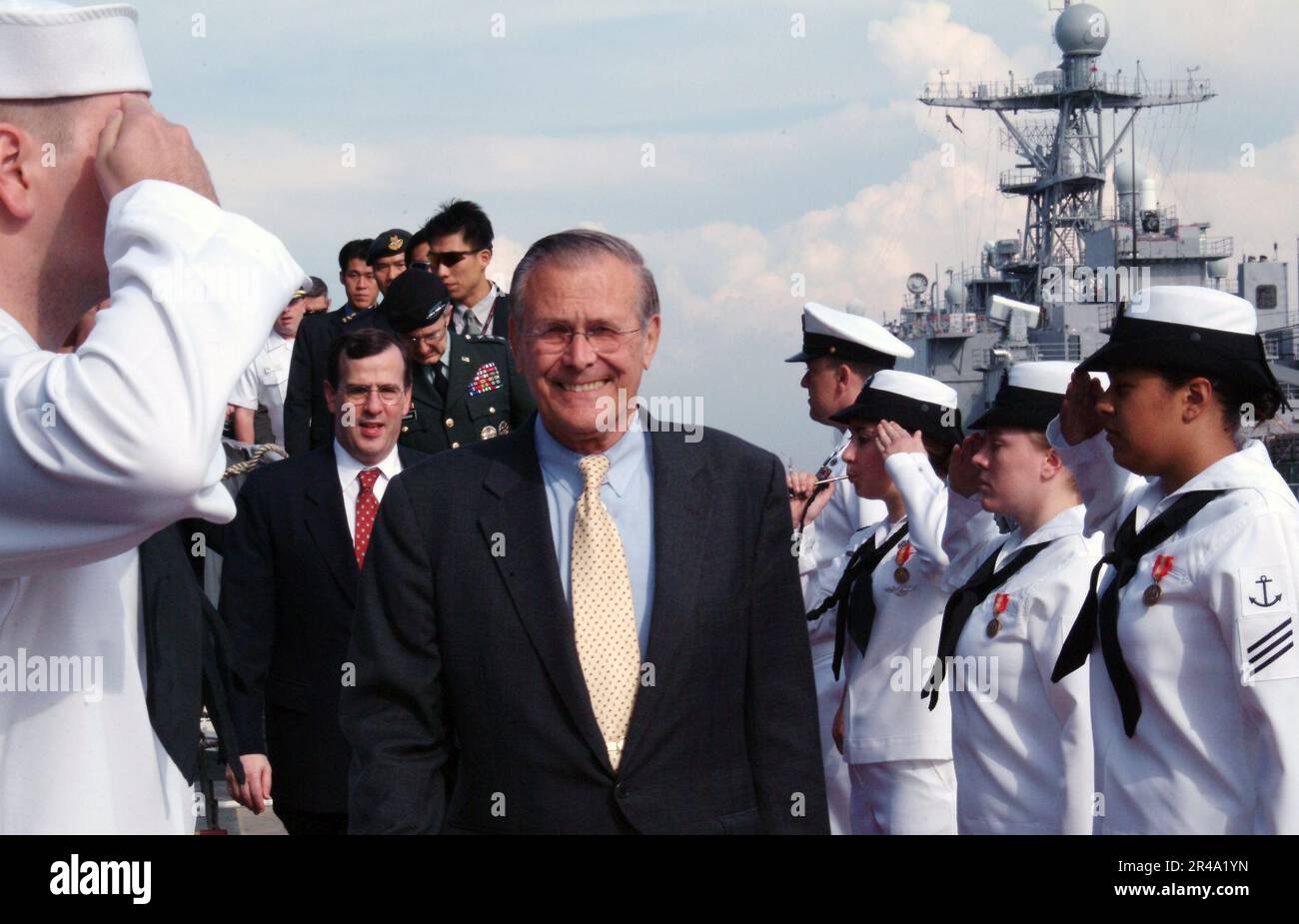 US Navy Secretary of Defense (SECDEF) Donald Rumsfeld receives side boy ...