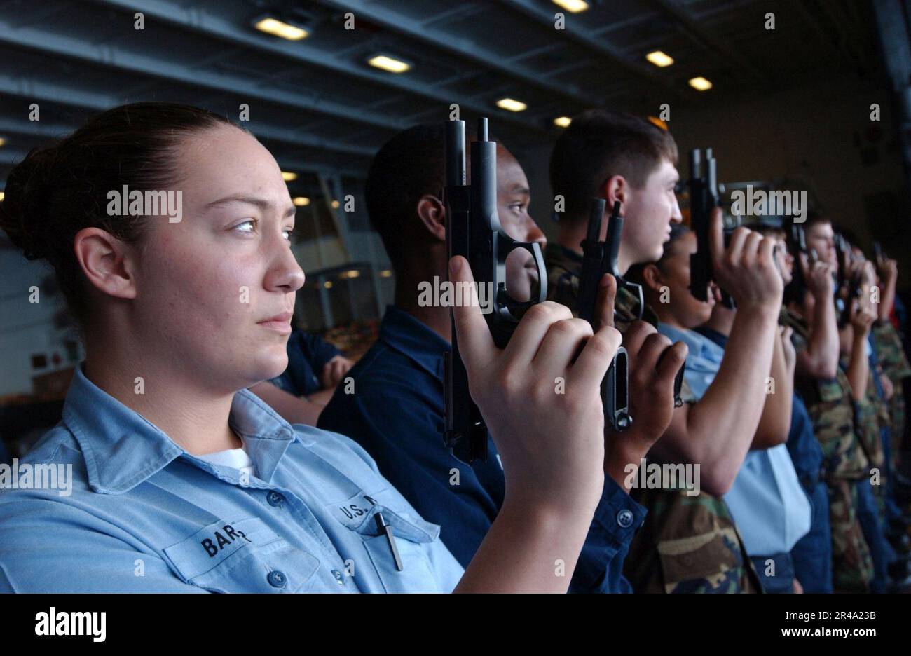 US Navy Sailors temporarily assigned to the Security Department aboard ...
