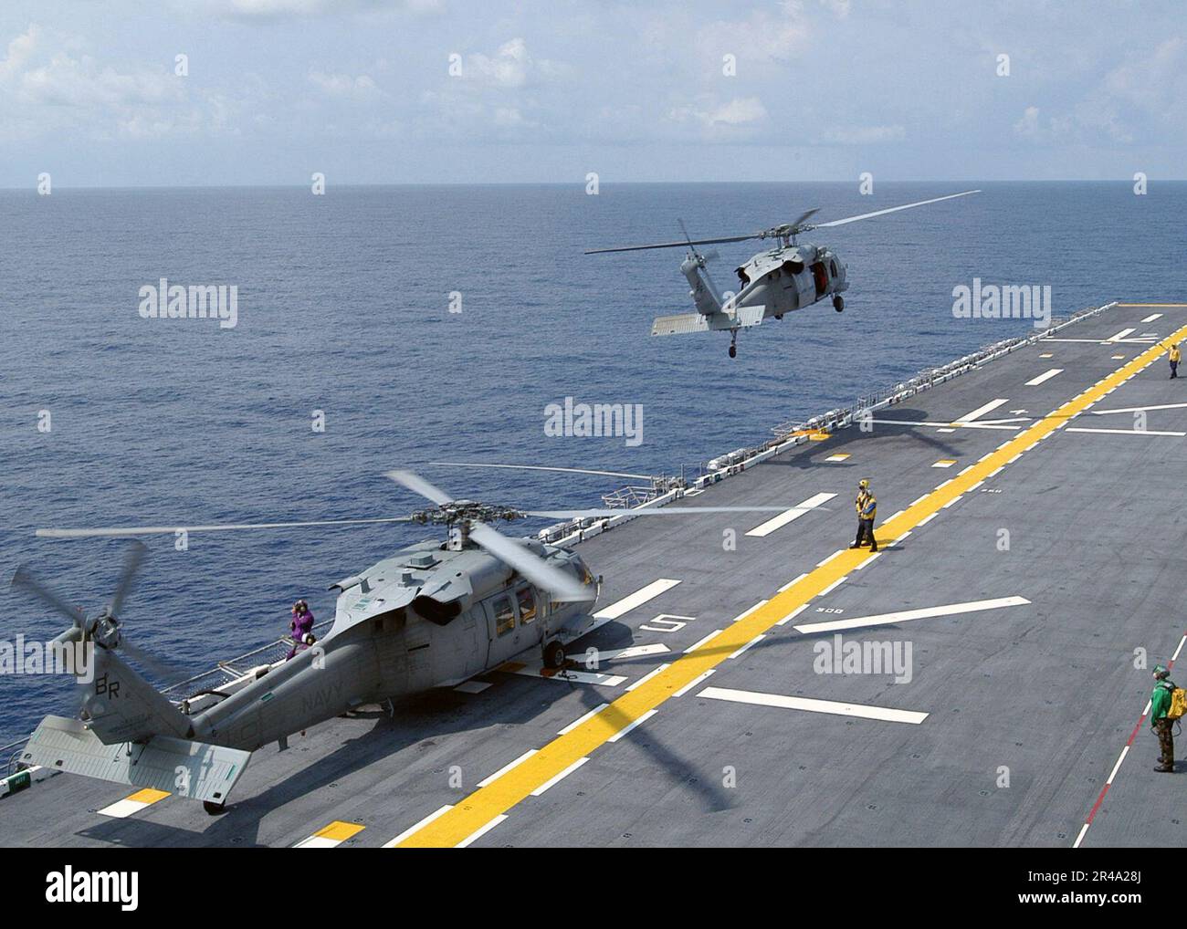 US Navy Two MH-60S Knighthawk helicopters takeoff during flight ...
