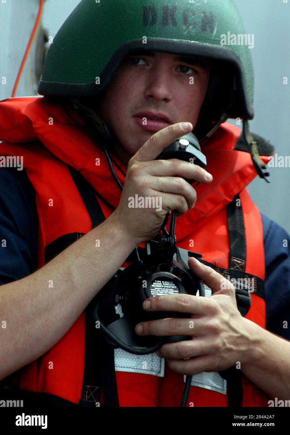 US Navy Seaman stands watch aboard the amphibious assault ship USS ...