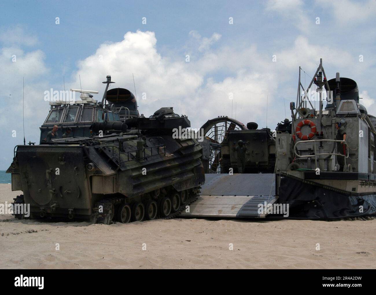 US Navy Marines assigned to the 24th Marine Expeditionary Unit (24th MEU) load Landing Assault ...