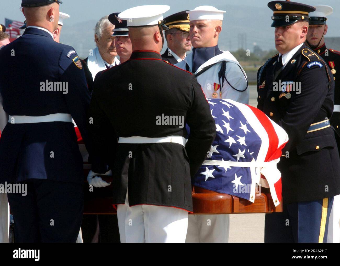 US Navy Ceremonial Honor Guard personnel carry former President Ronald Reagan's flag-draped ...
