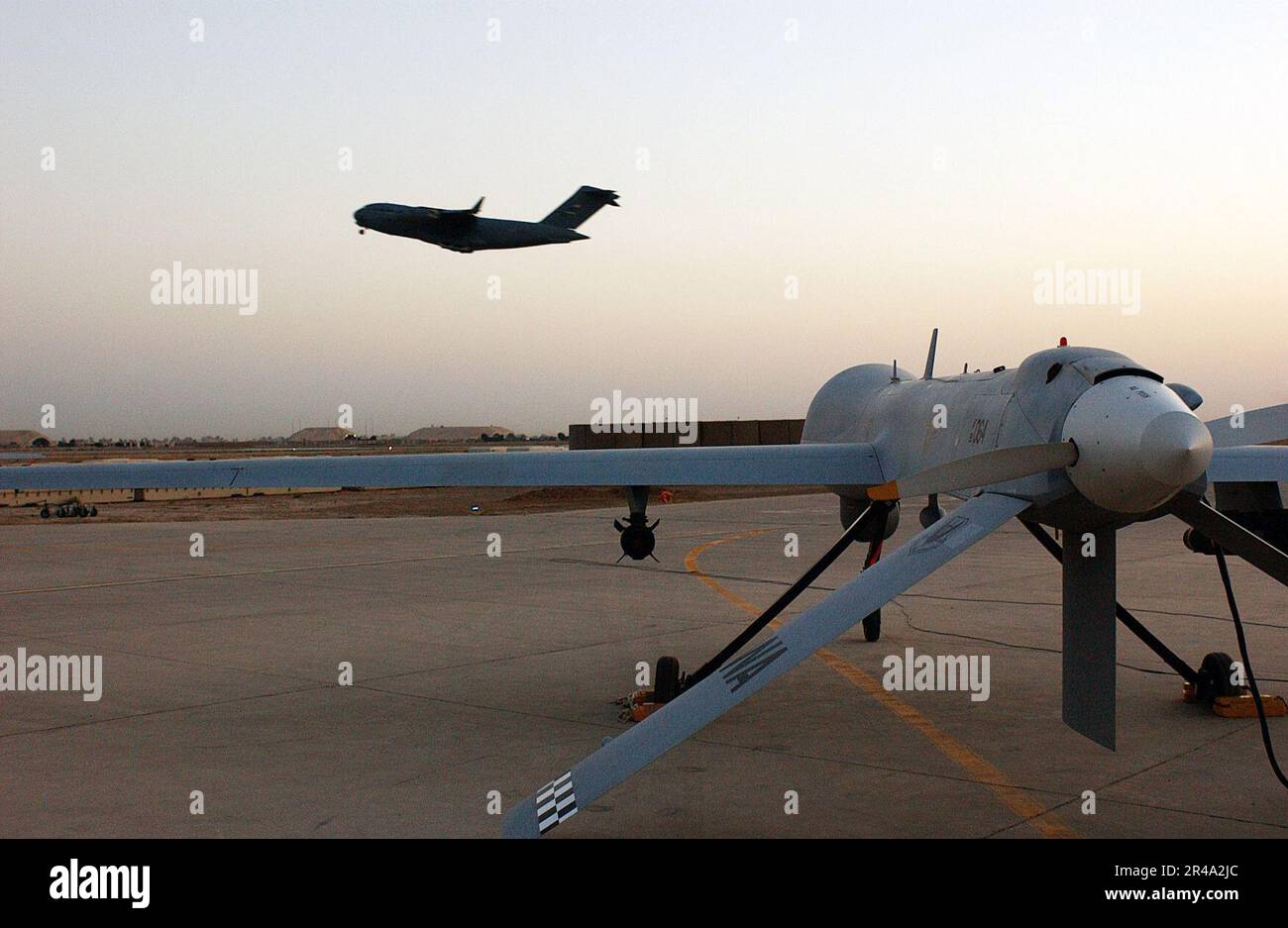 US Navy A C-17 Globemaster III takes off from Balad Air Base, Iraq as a ...