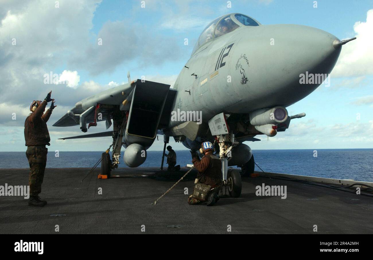 US Navy A plane captain assigned to the Swordsmen of Fighter Squadron ...