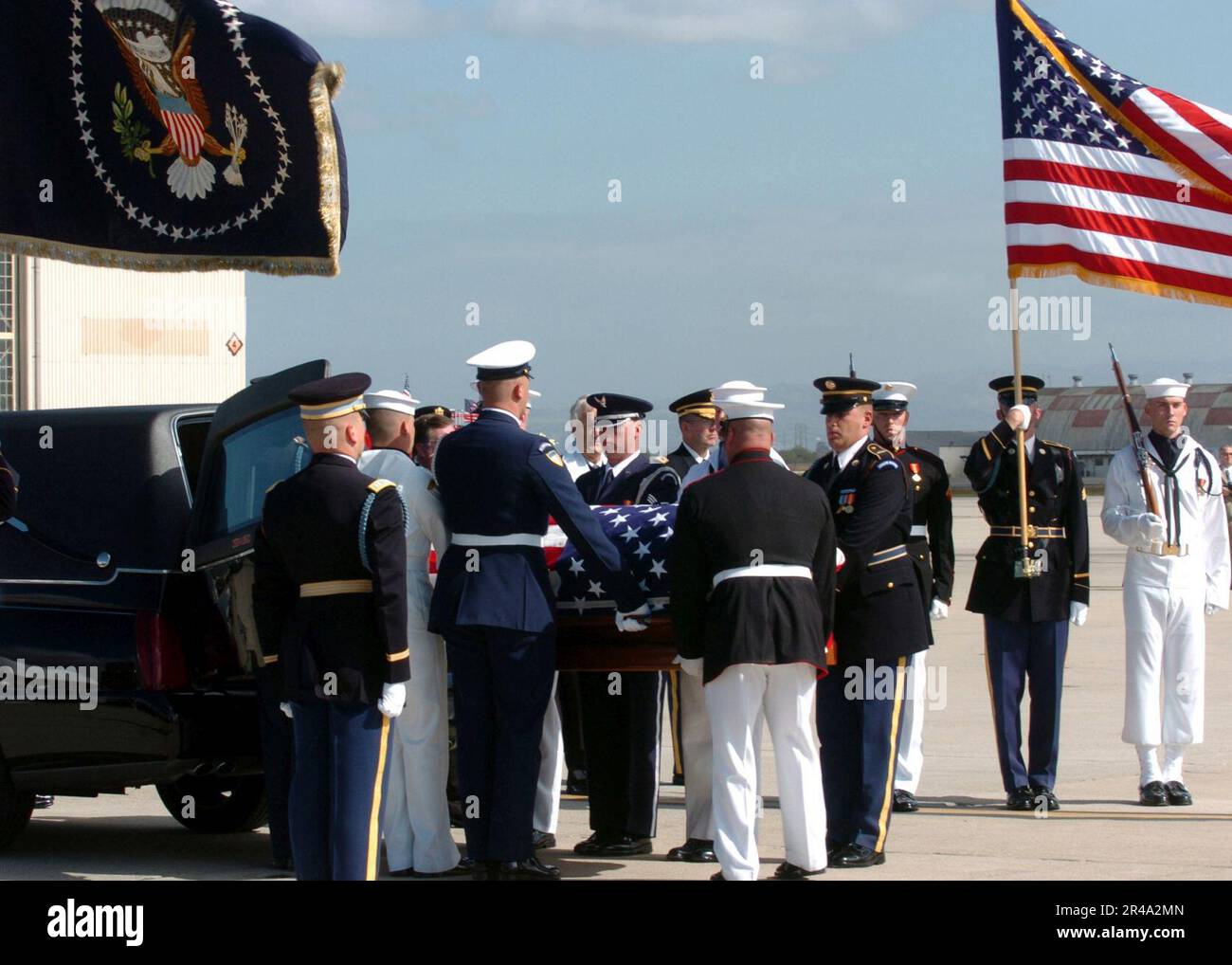 US Navy Ceremonial Honor Guard personnel remove former President Ronald ...