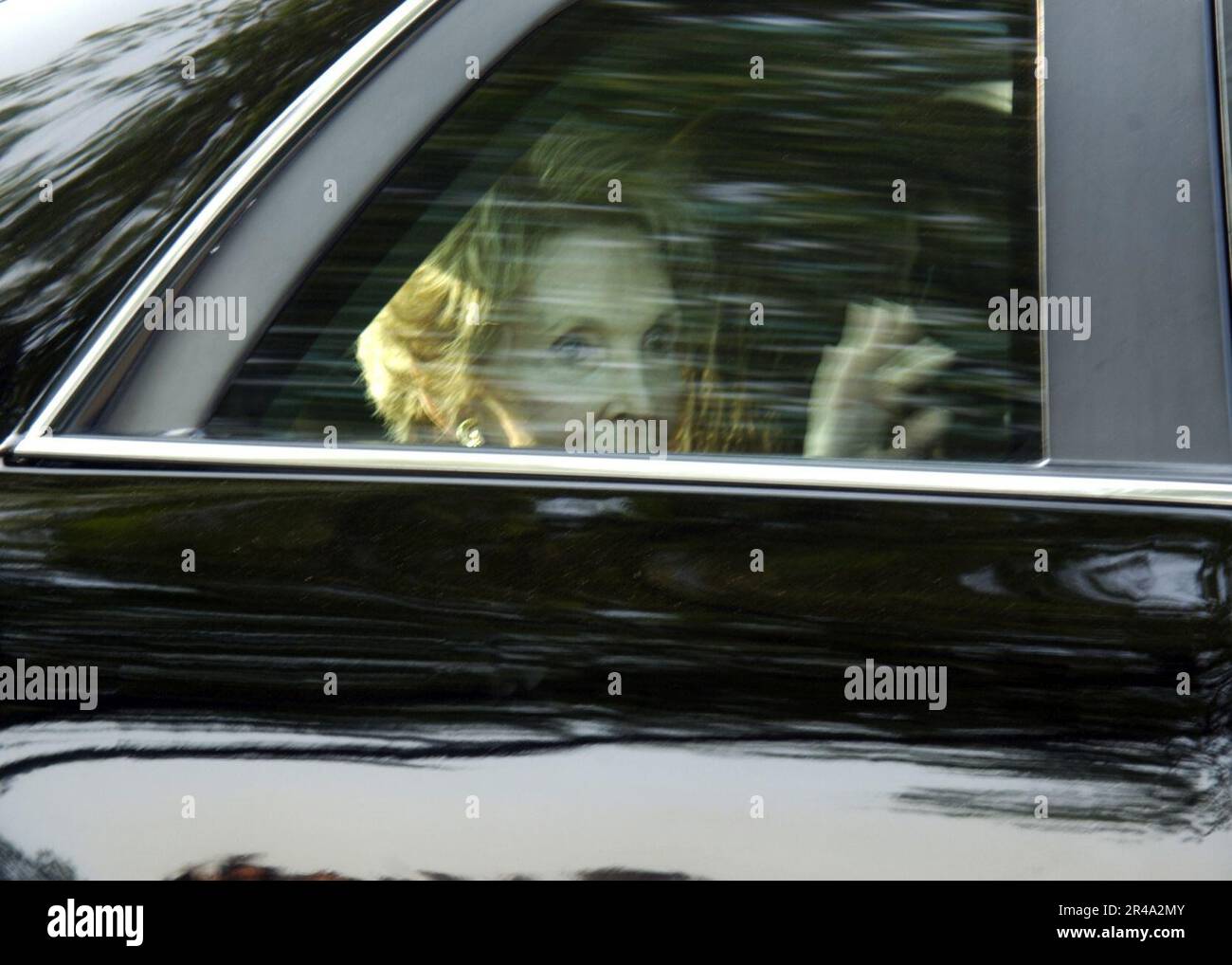 US Navy Former First Lady Nancy Reagan waves from her limousine as it ...