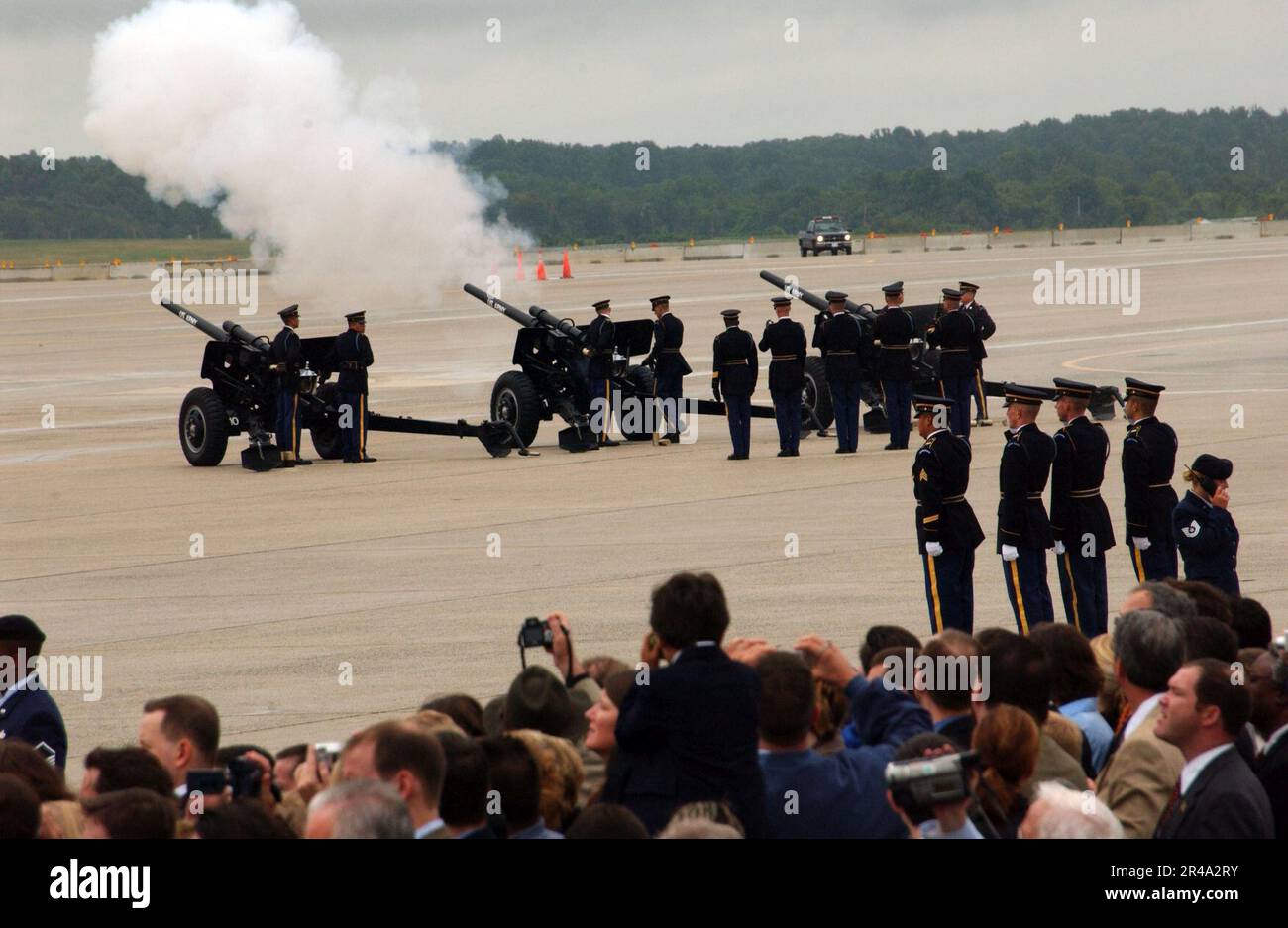 US Navy Ceremonial Honor Guard fire howitzers cannons to render honors ...