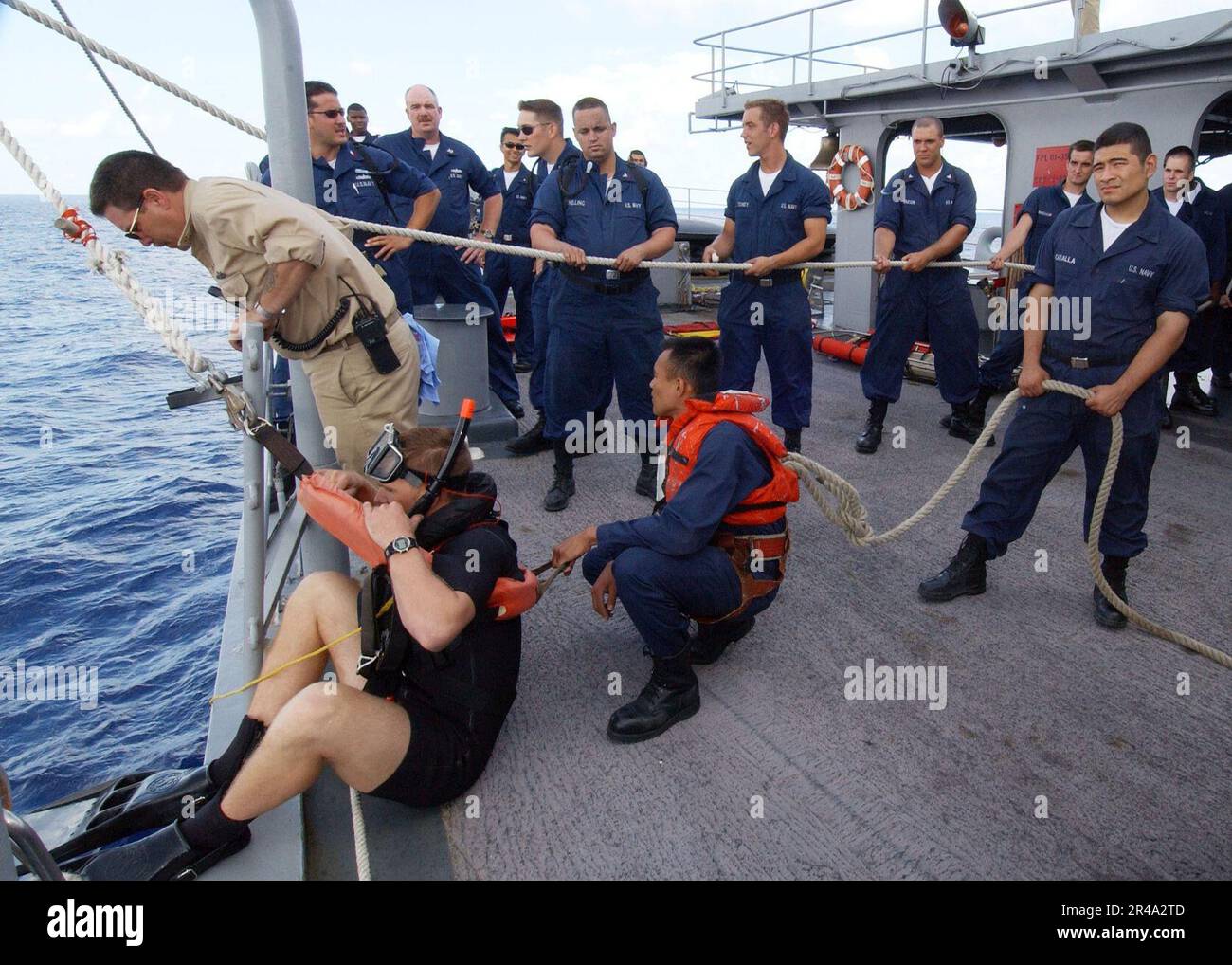 US Navy Sailors assigned to the fast combat support ship USS Seattle ...