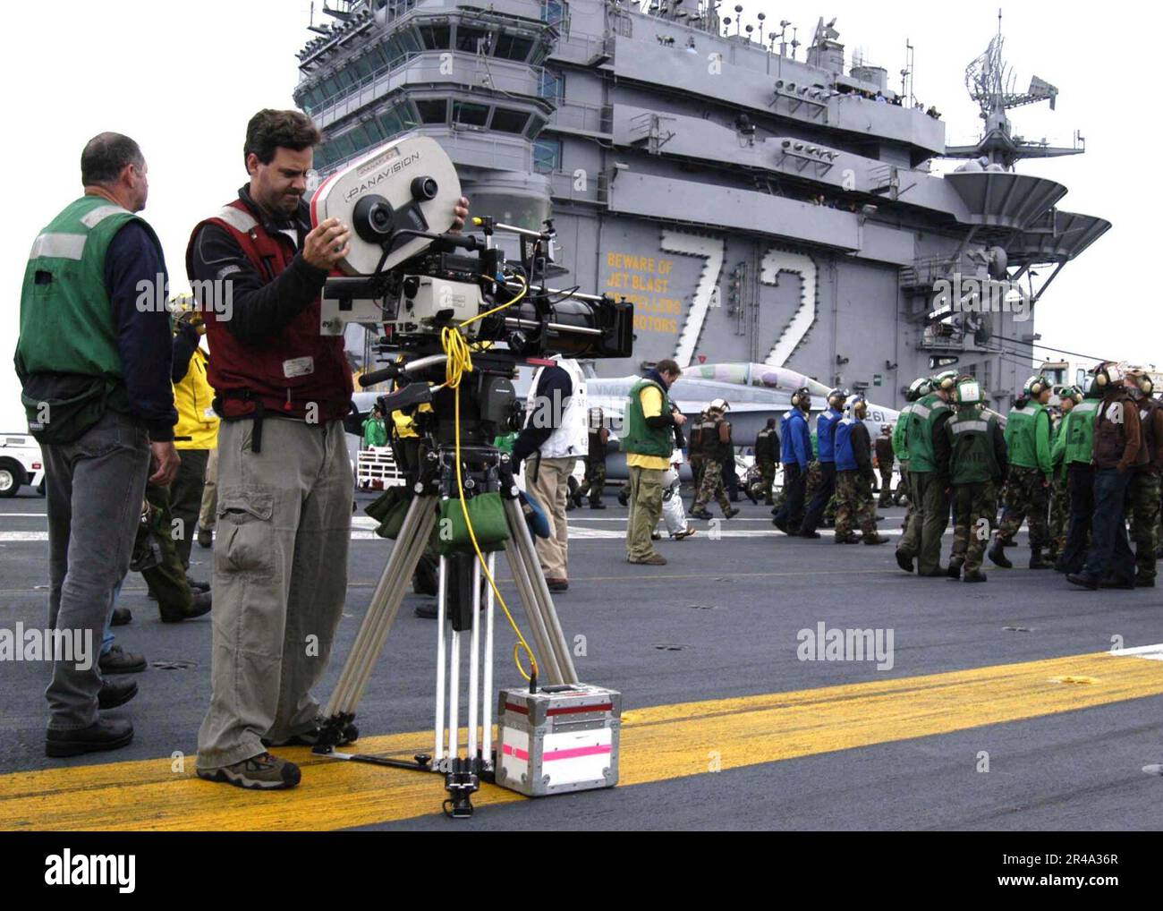 US Navy A camera crew sets up for scenes to be taped on the flight deck ...