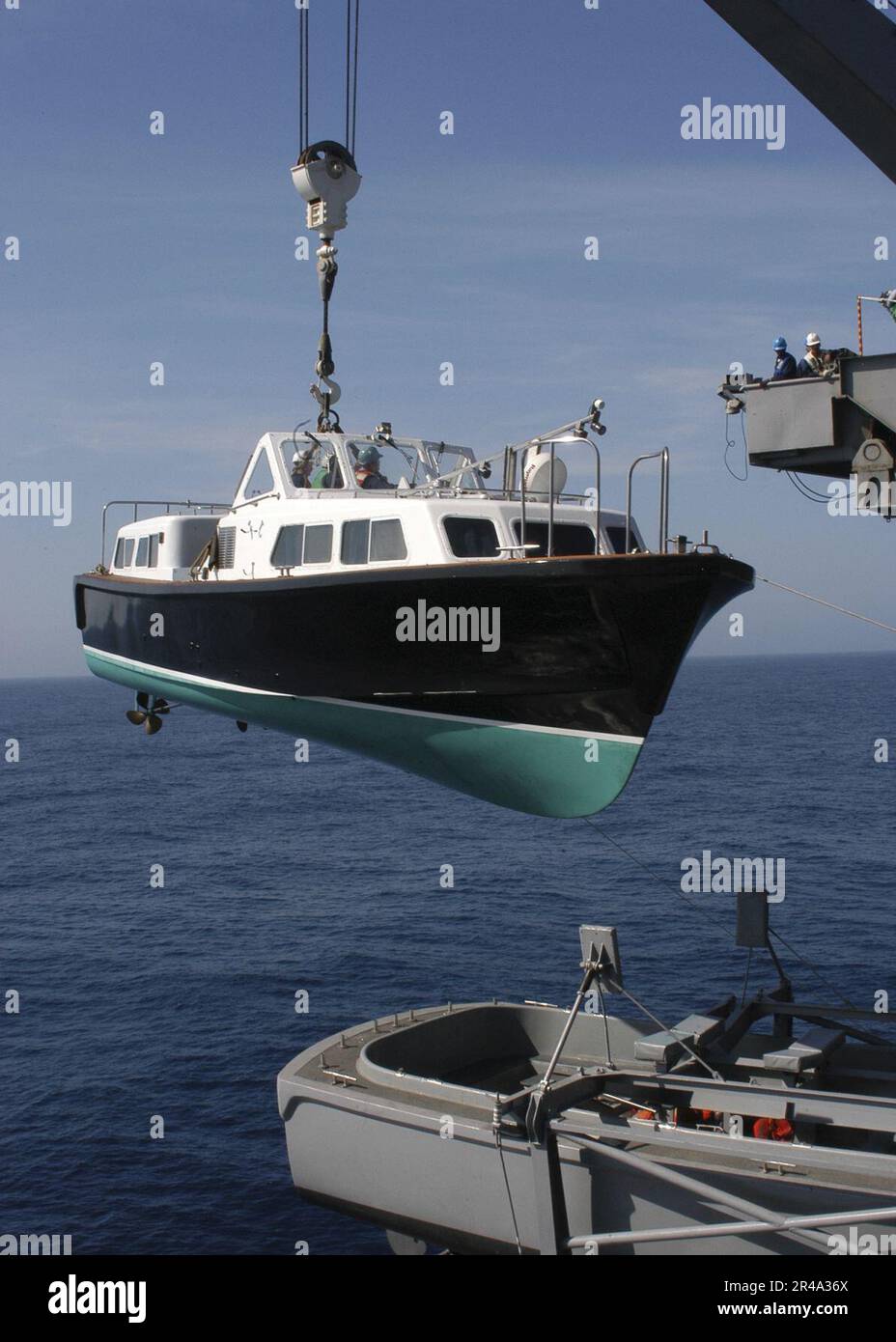 US Navy USS Enterprise (CVN 65) Sailors hoist the Admiral's Barge back ...