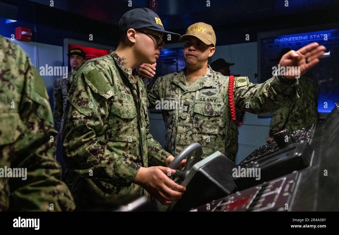 Command Master Chief Van-Troi SibiliaMartinez speaks with a recruit ...